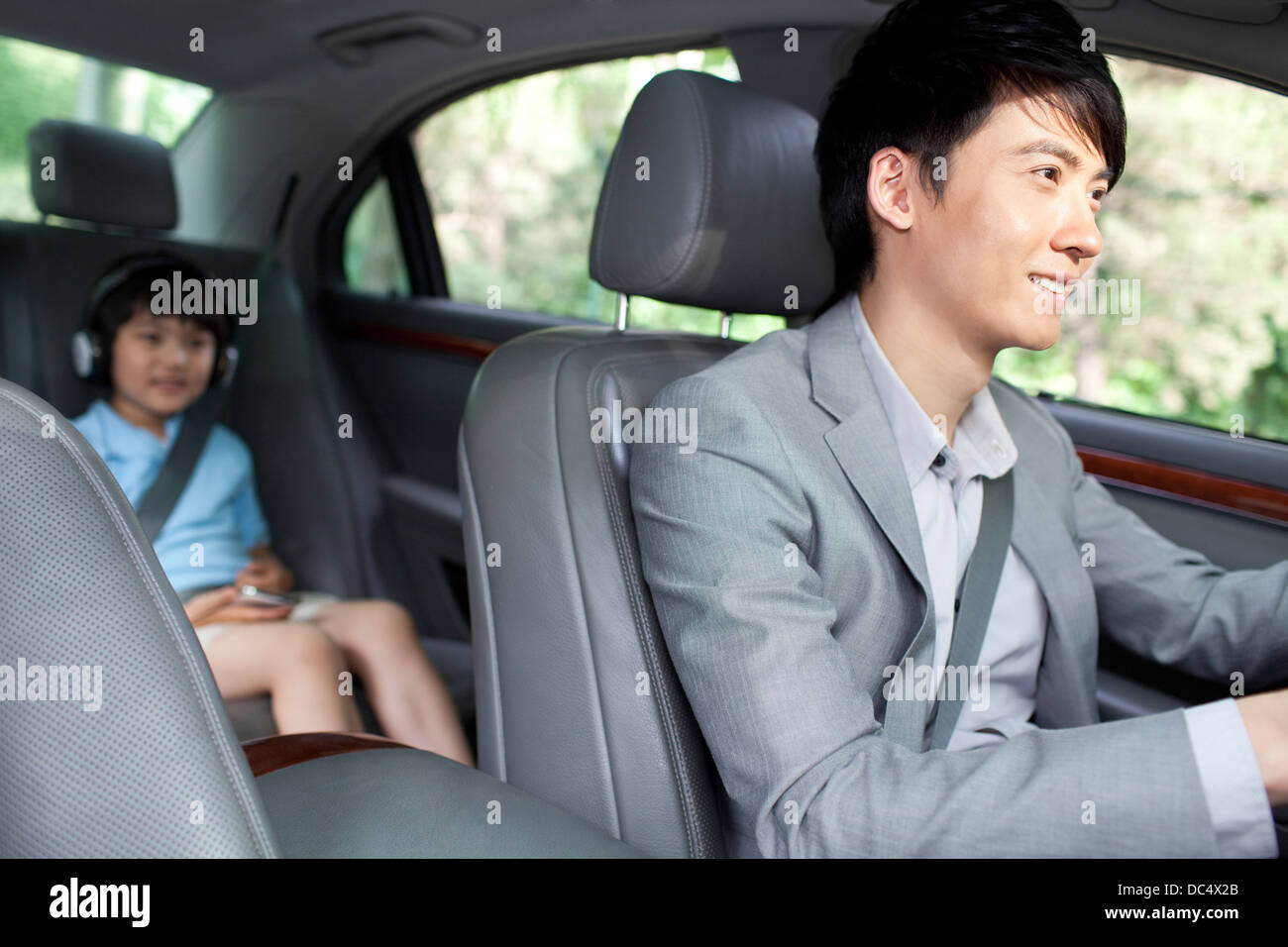 Father Driving Young Son In Stock Photos & Father Driving Young Son In ...