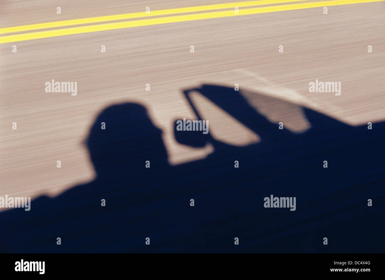 Shadow of convertible and driver on highway Stock Photo - Alamy
