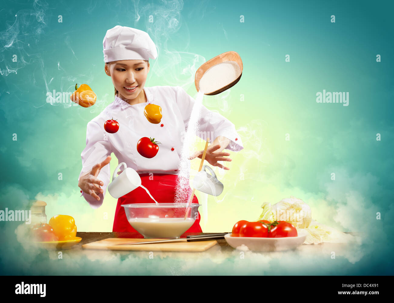 Asian female cooking with magic Stock Photo - Alamy