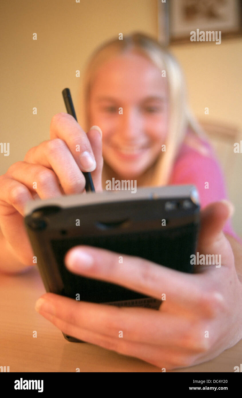 Personal digital assistant and teen hi-res stock photography and images ...