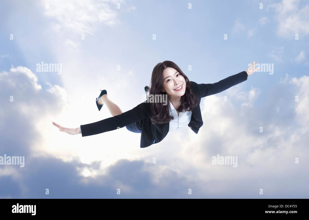 a businessman flying in the sky Stock Photo - Alamy