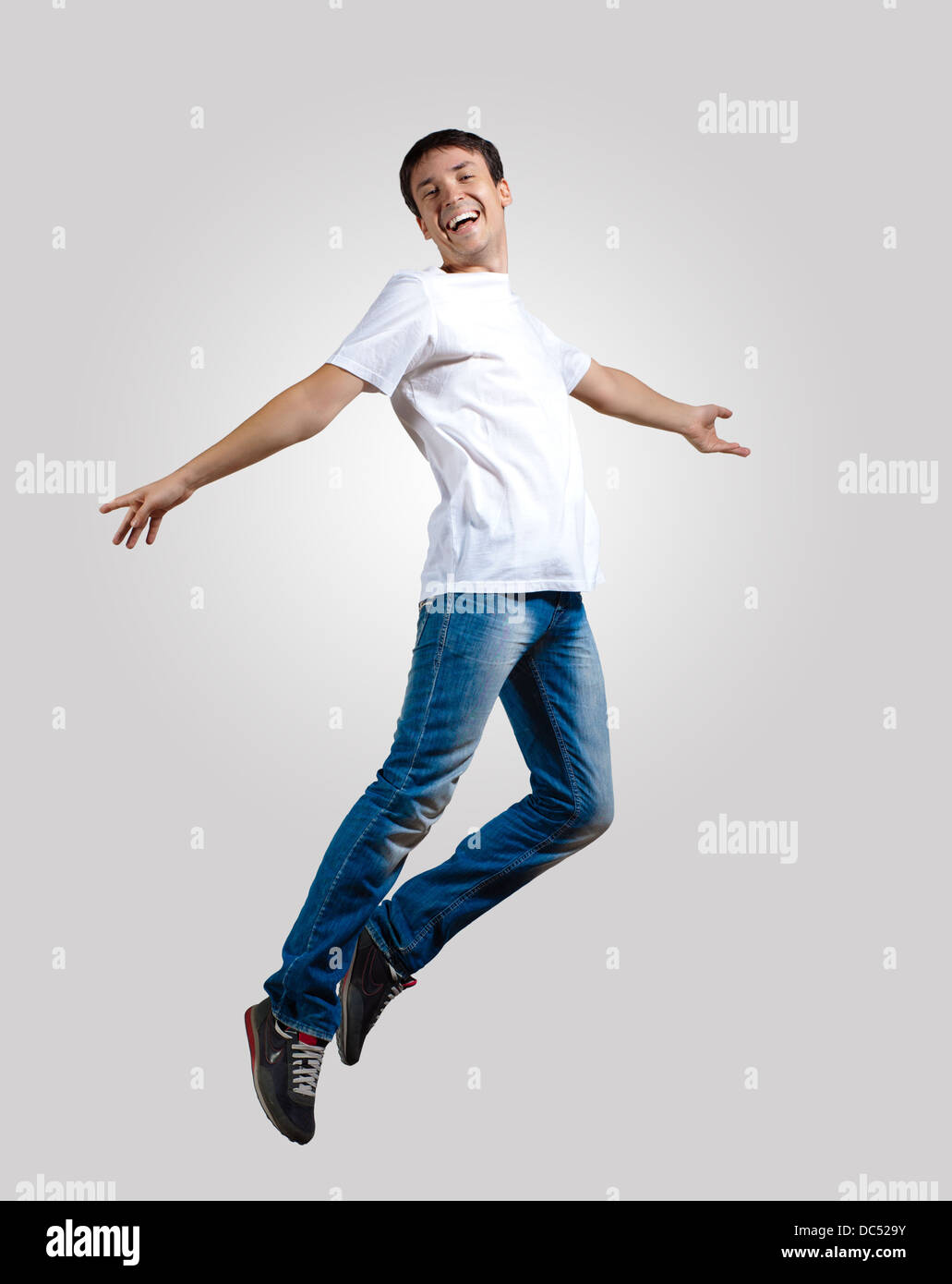 Young man dancing and jumping Stock Photo - Alamy