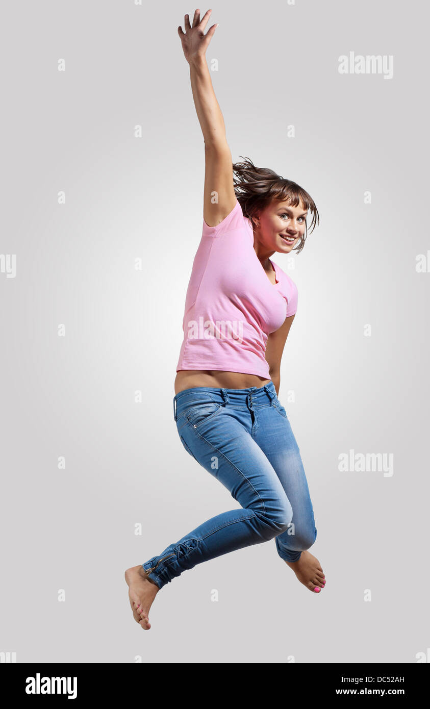 young woman dancing and jumping Stock Photo - Alamy