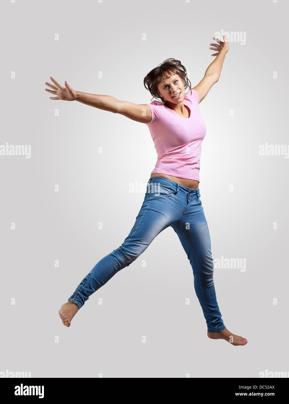 young woman dancing and jumping Stock Photo - Alamy