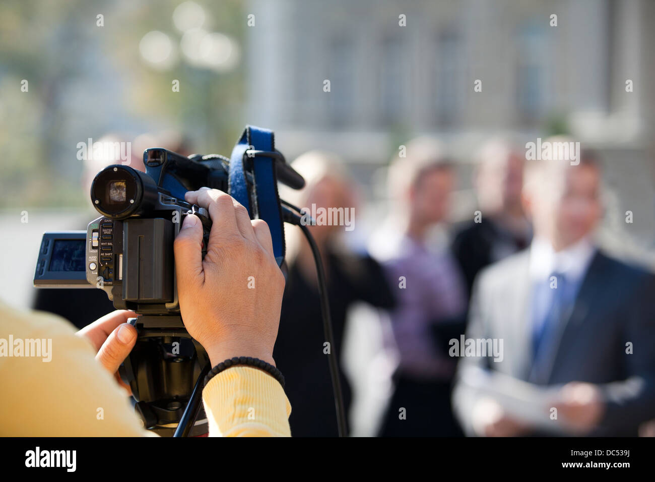 covering an event with a video camera Stock Photo - Alamy