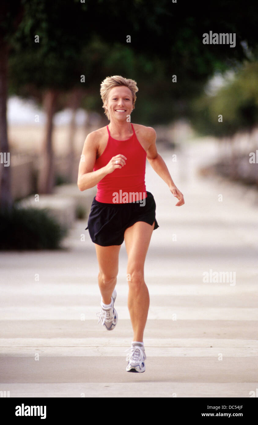 Woman out jogging Stock Photo - Alamy
