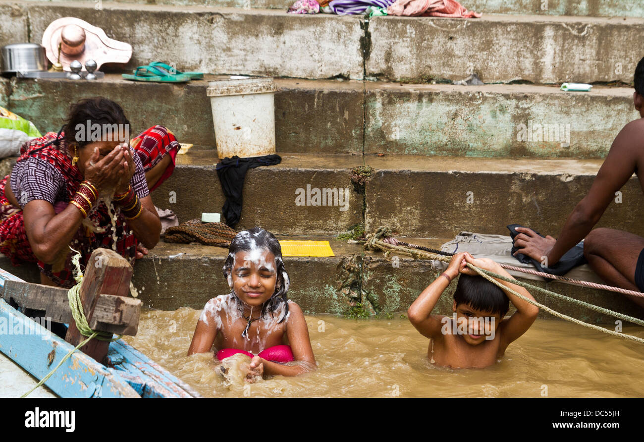 Indian women bathing in polluted hi-res stock photography and images ...
