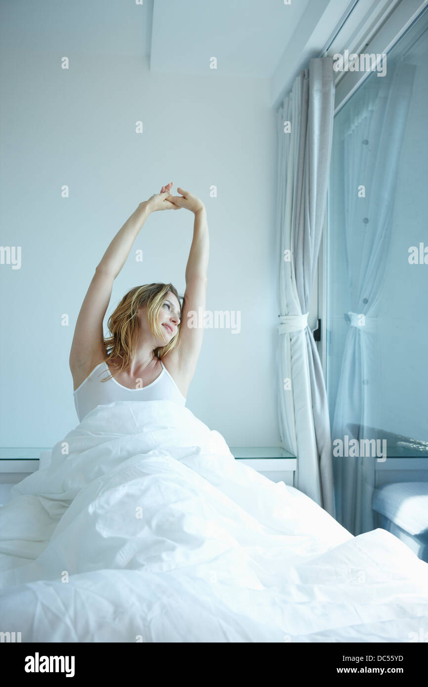 lady waking up on white bed Stock Photo - Alamy