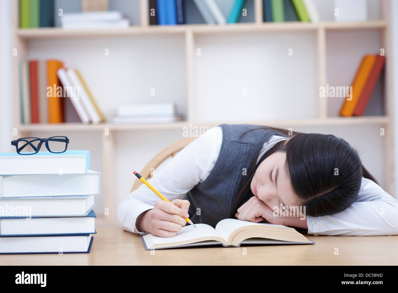 student in school uniform studying lying leaning on desk Stock Photo ...