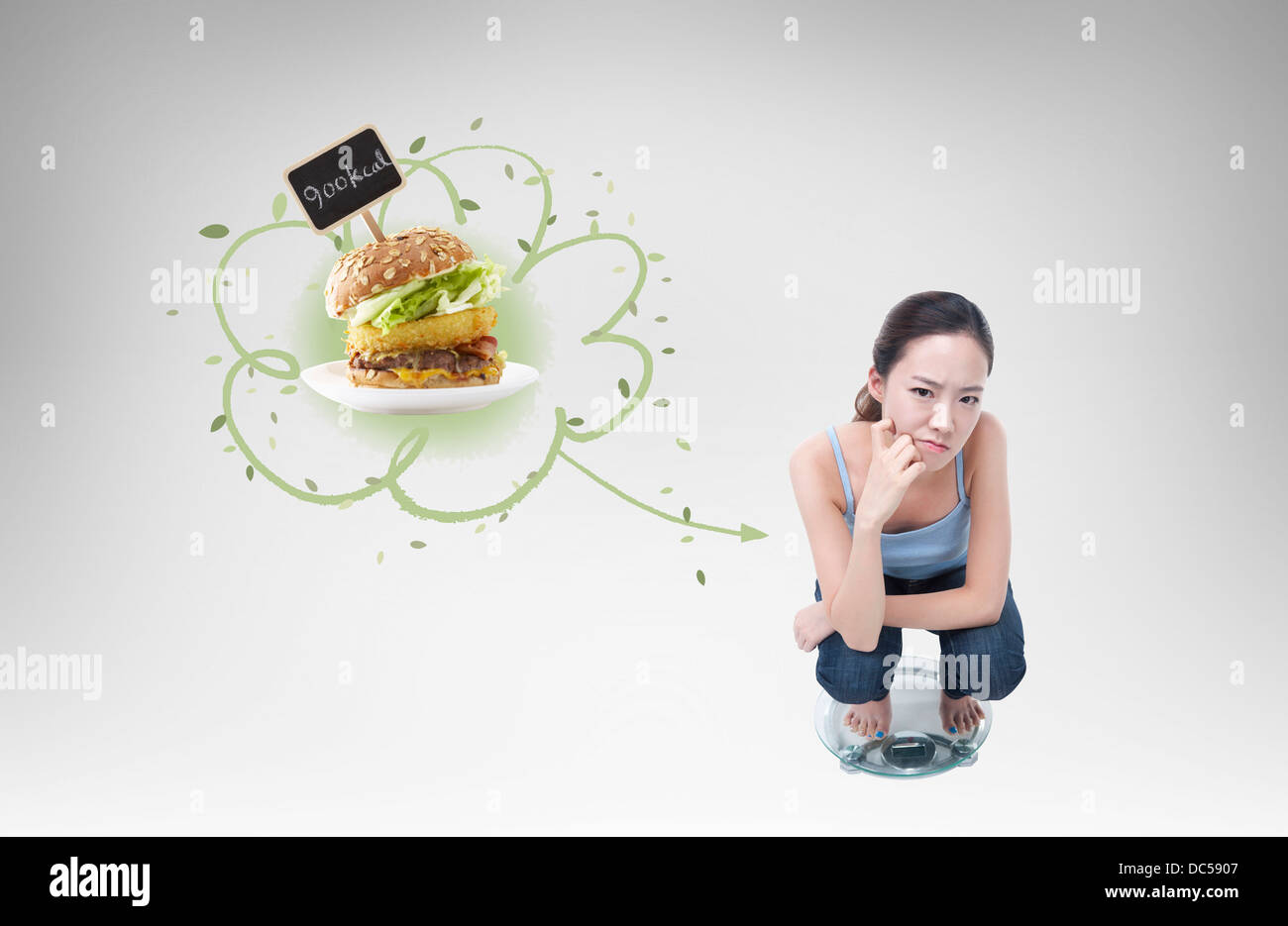 a woman thinking of hamburger Stock Photo - Alamy