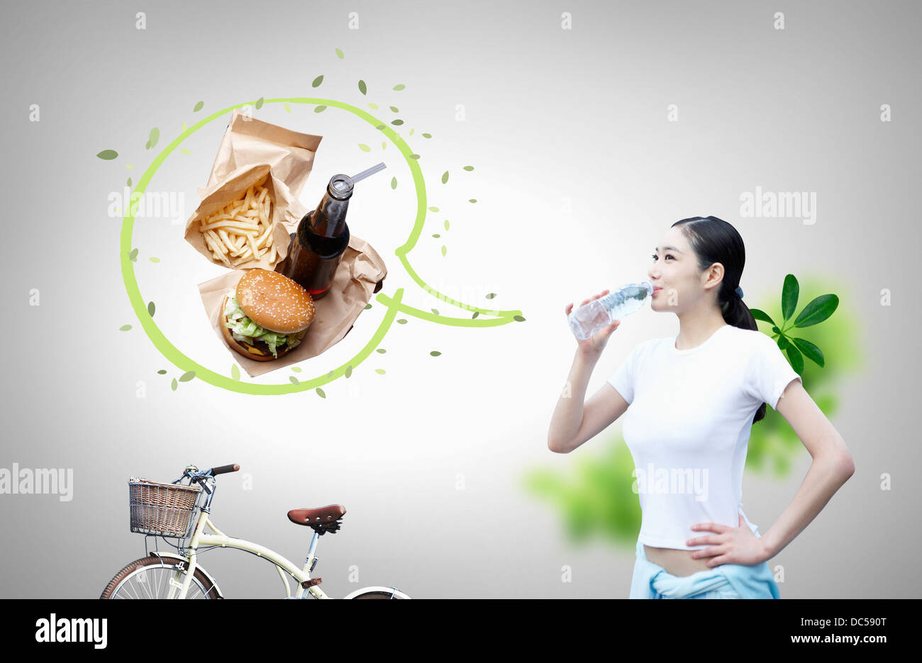a woman drinking water thinking of fast food Stock Photo - Alamy
