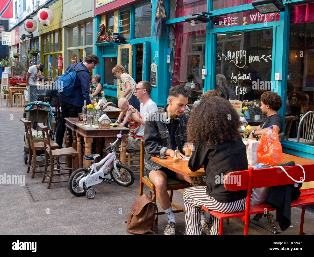 People eating at a fashionable restaurant in Brixton Market, London, UK ...