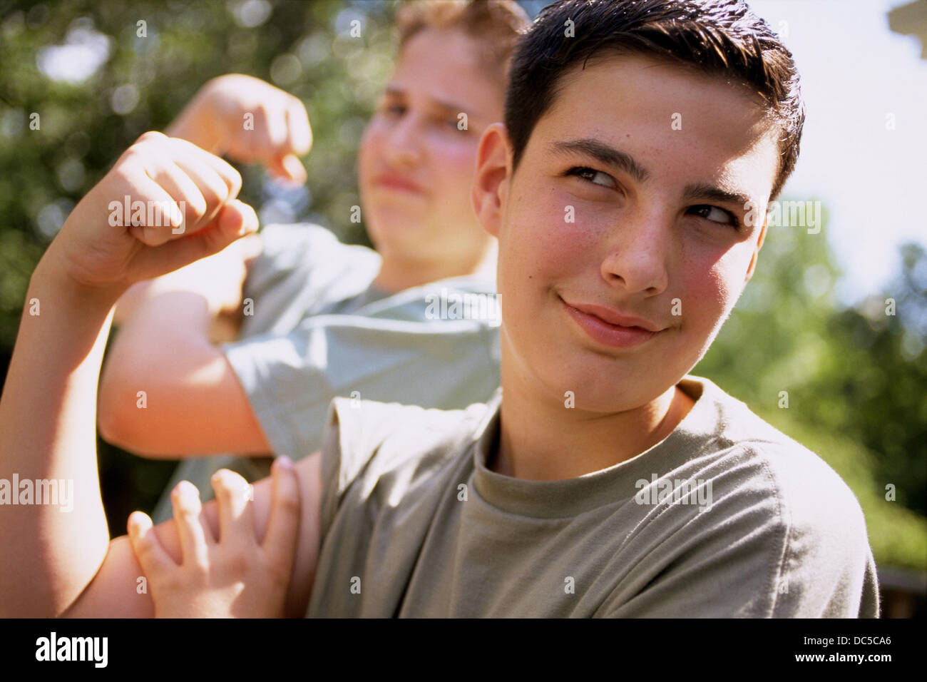 Boys flexing muscles hi-res stock photography and images - Alamy
