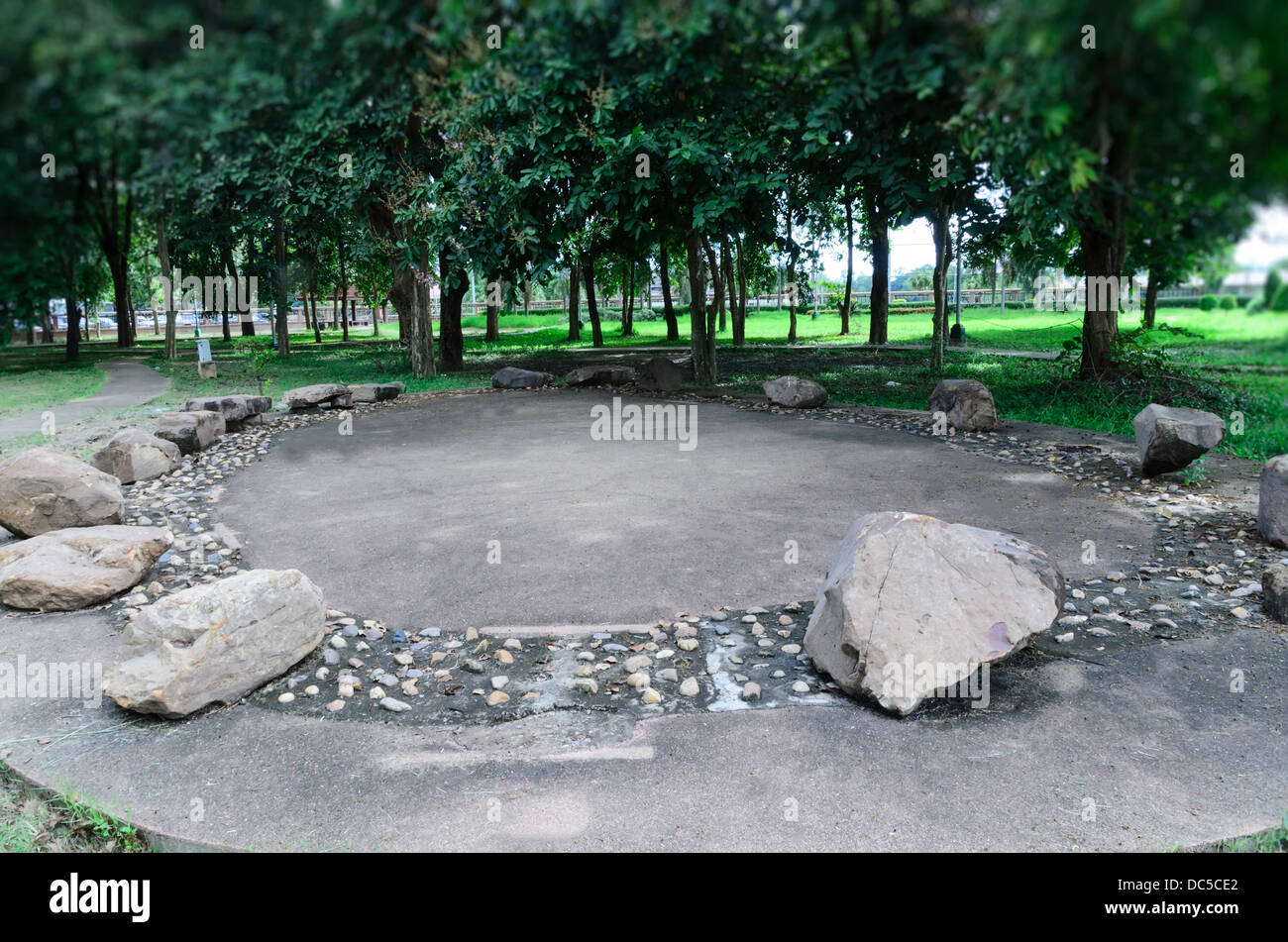 rock seat in the garden Stock Photo - Alamy