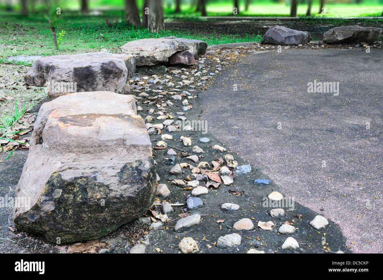 rock seat in the garden Stock Photo - Alamy
