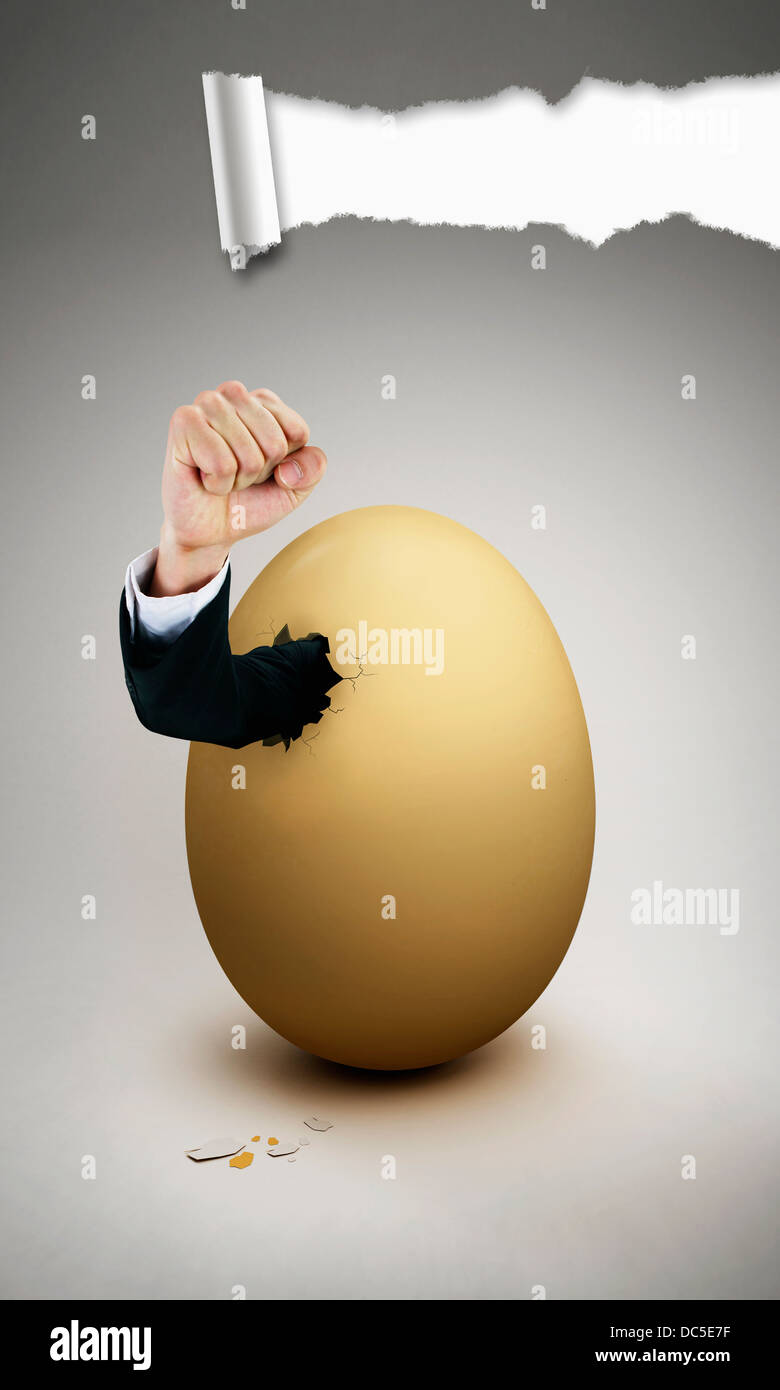 illustration of a hand breaking from an egg Stock Photo - Alamy