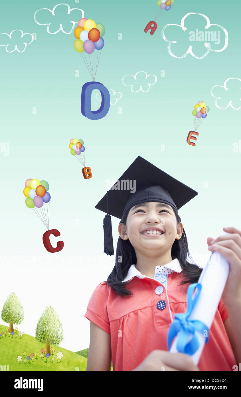 a kid with a graduation hat Stock Photo - Alamy