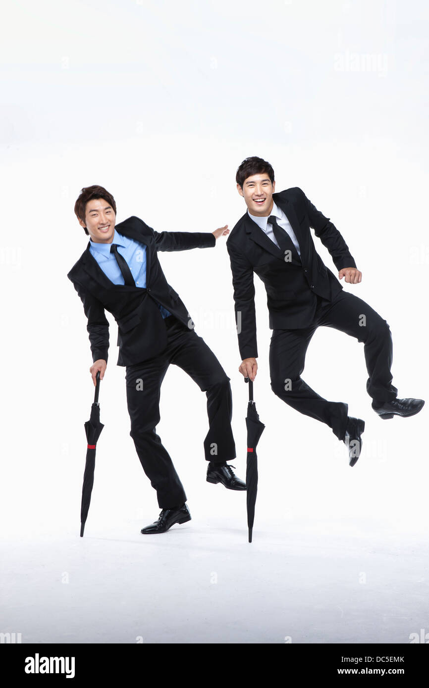 two businessmen with strange pose Stock Photo - Alamy