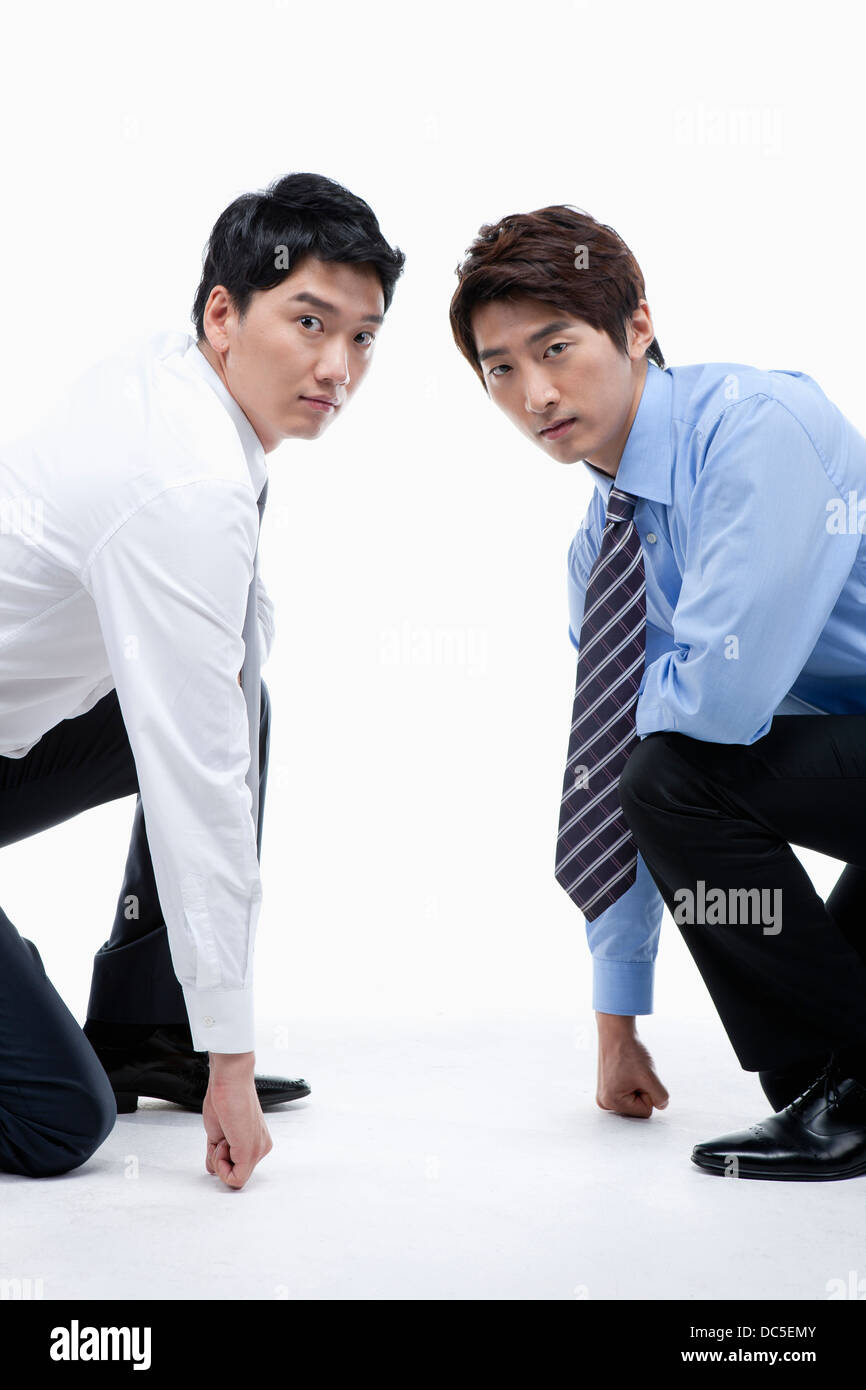 two businessmen facing each other as a rival Stock Photo - Alamy