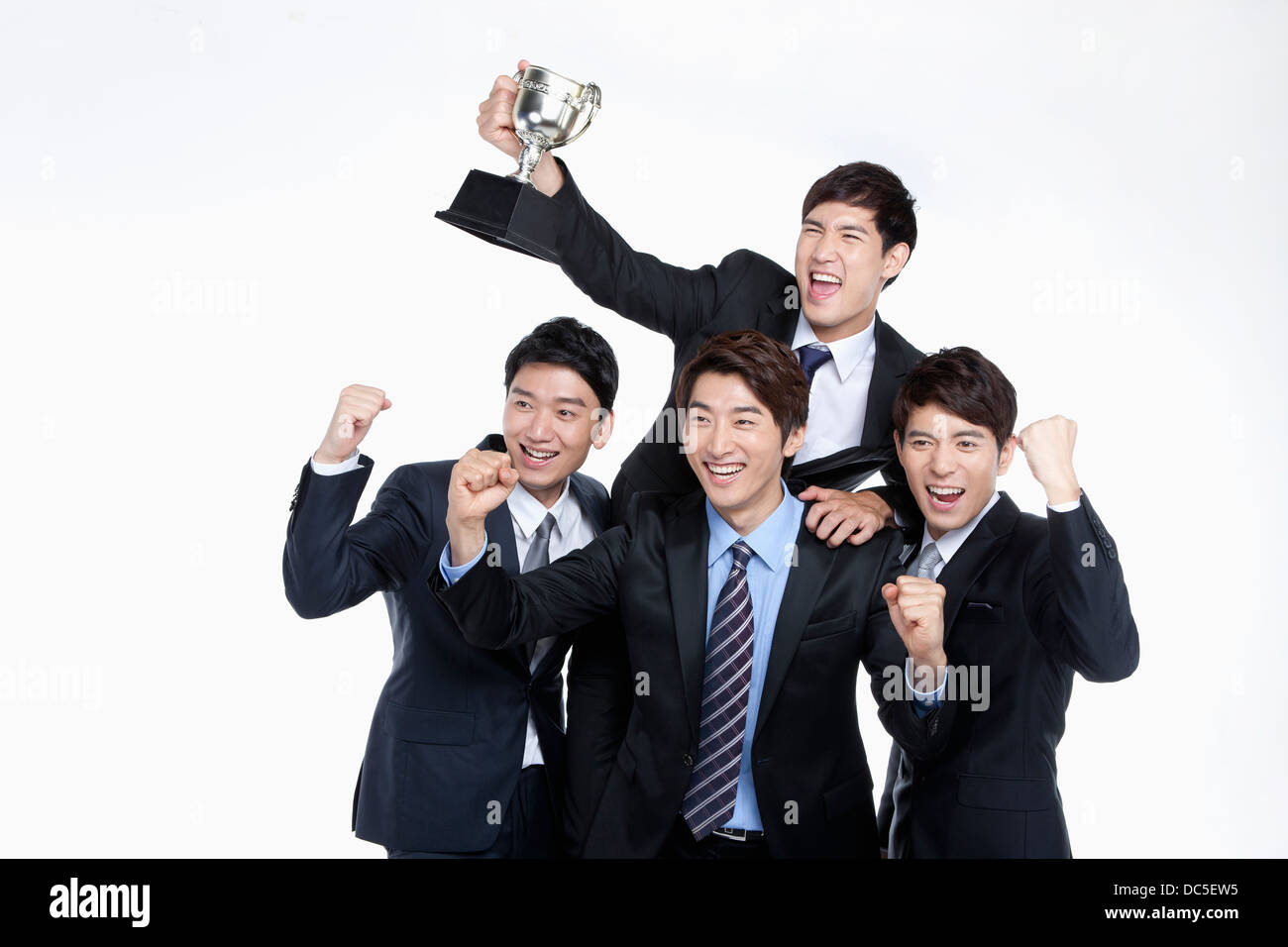 Asian man holding trophy hi-res stock photography and images - Alamy