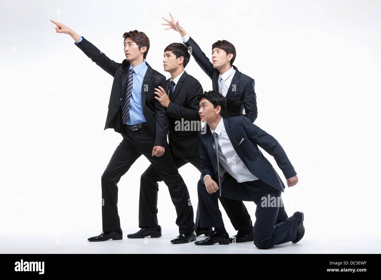 businessmen trying to reach something Stock Photo - Alamy