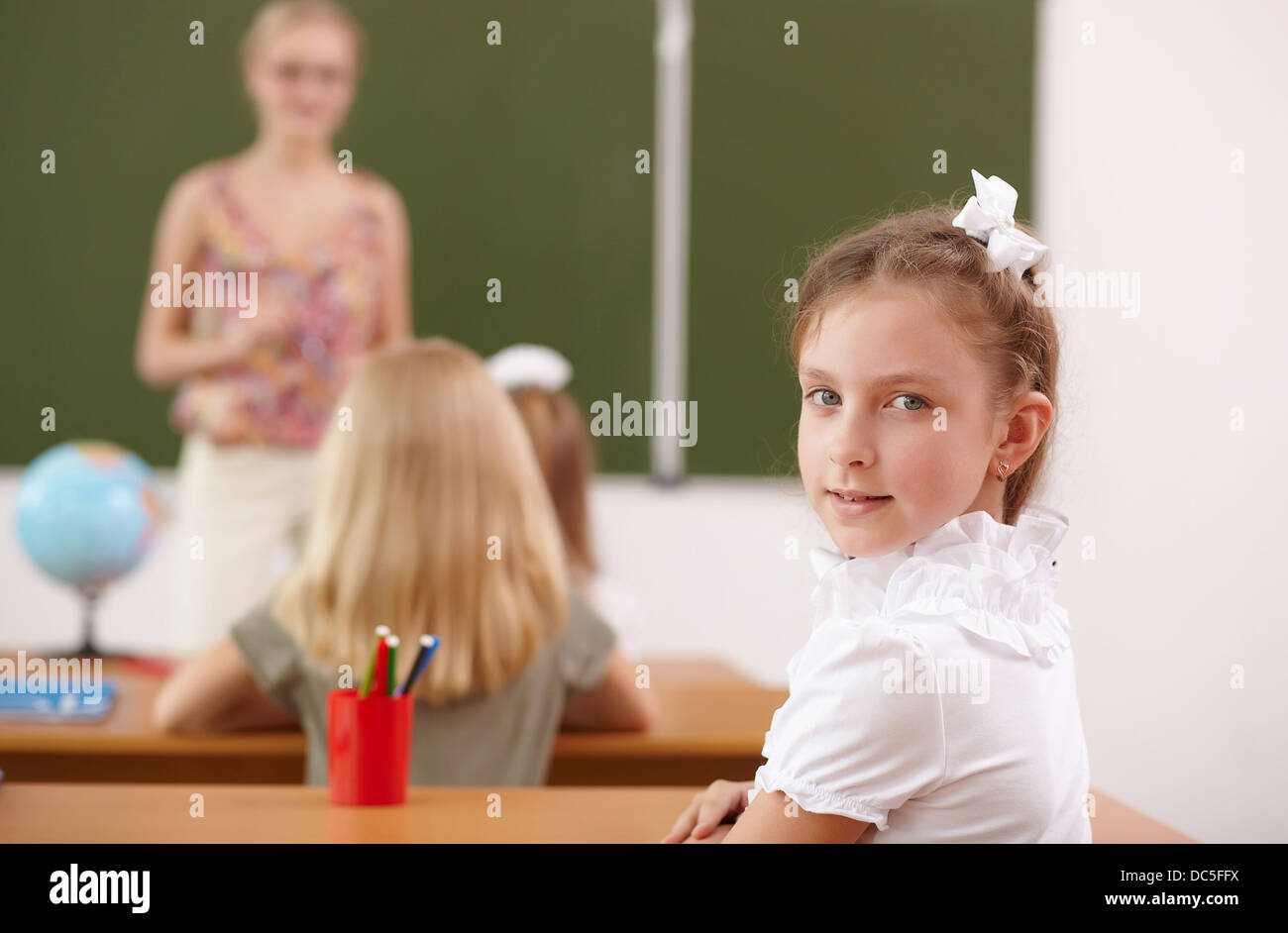 Little girl at school class Stock Photo - Alamy