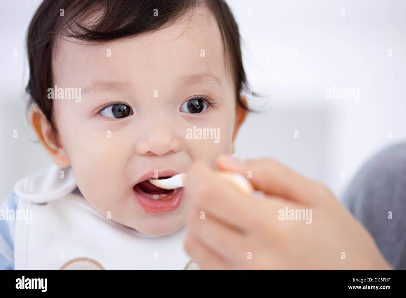 a baby having a food Stock Photo - Alamy