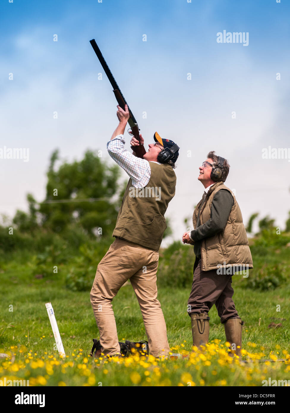 Two men shooting at a simulated game shooting clay shoot Stock Photo ...