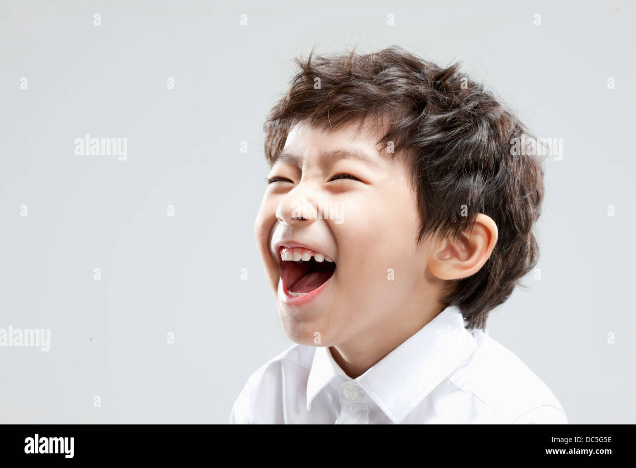 close up shot of a boy laughing Stock Photo - Alamy