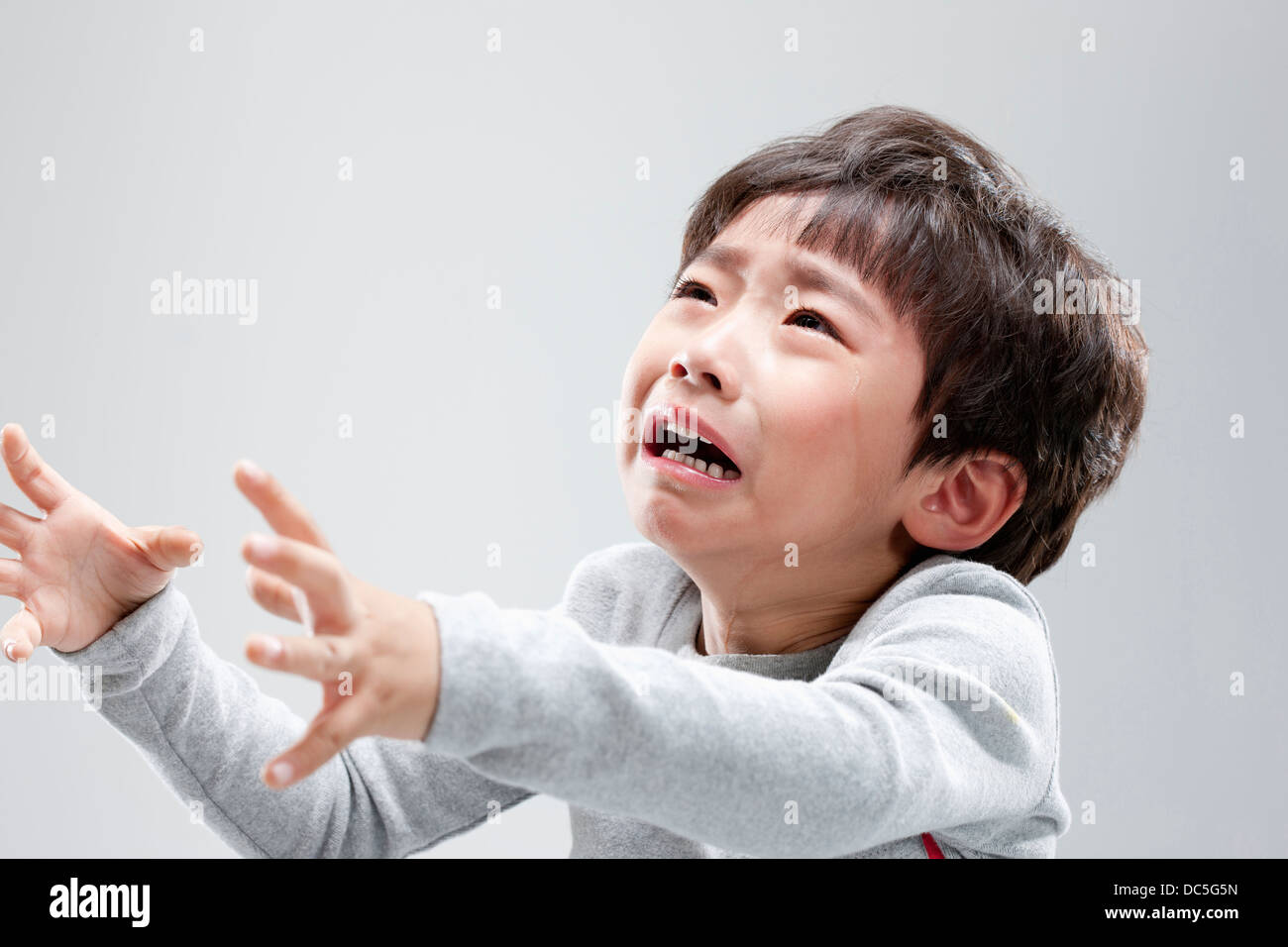 close up shot of a boy crying Stock Photo - Alamy