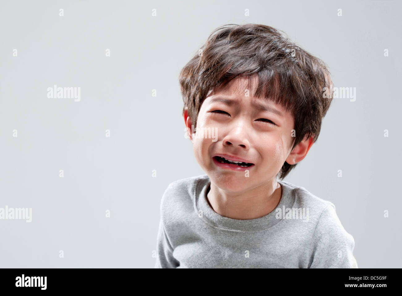 close up shot of a boy crying Stock Photo - Alamy