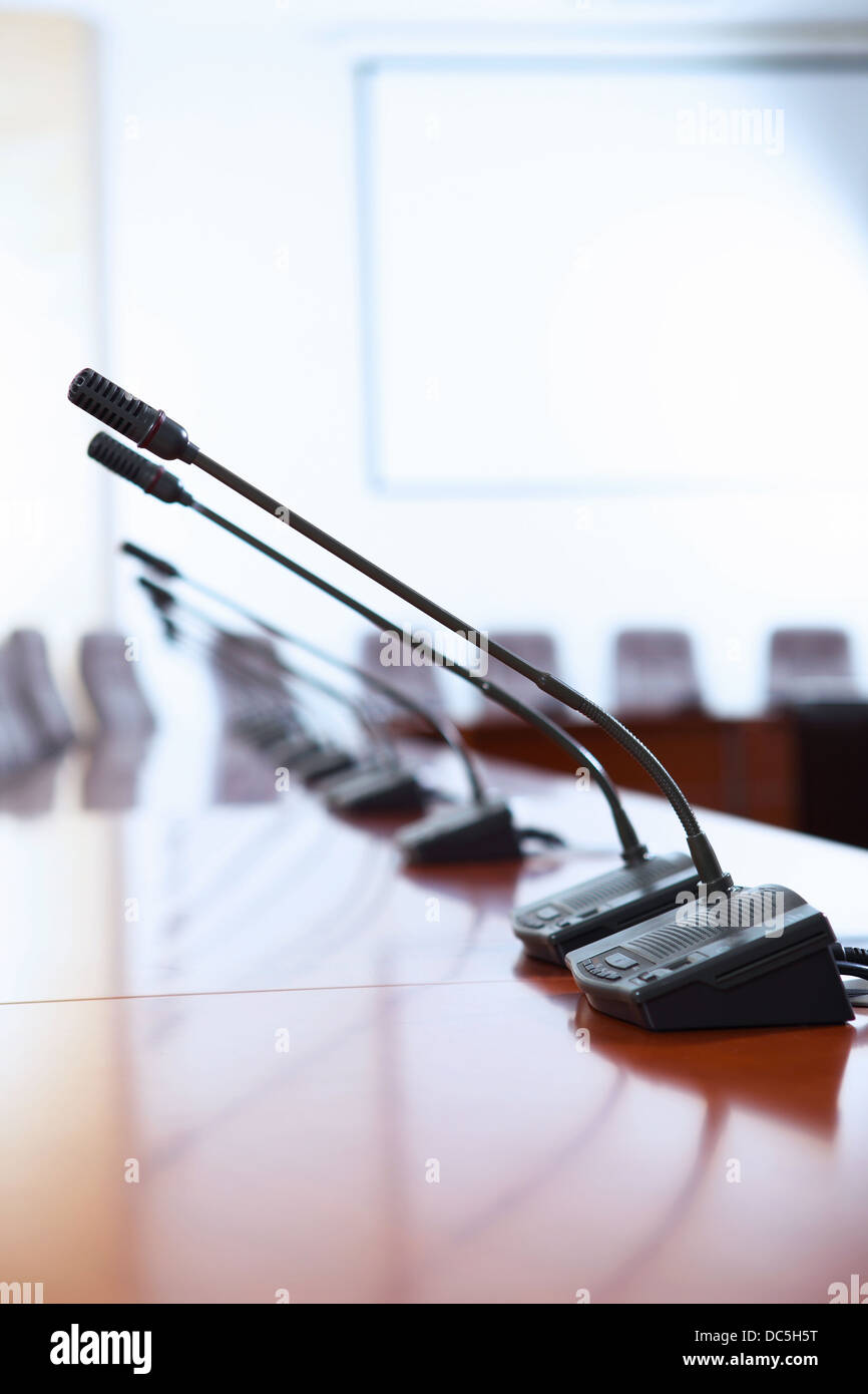 Conference hall with microphones Stock Photo - Alamy