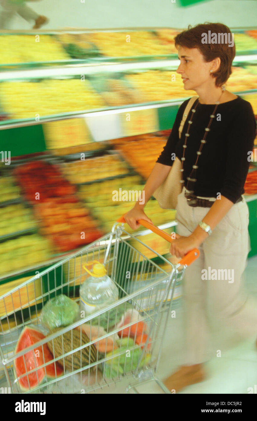 Woman at the supermarket Stock Photo - Alamy