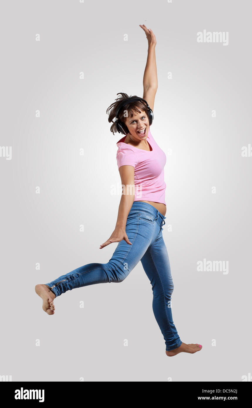 young woman dancing and jumping Stock Photo - Alamy