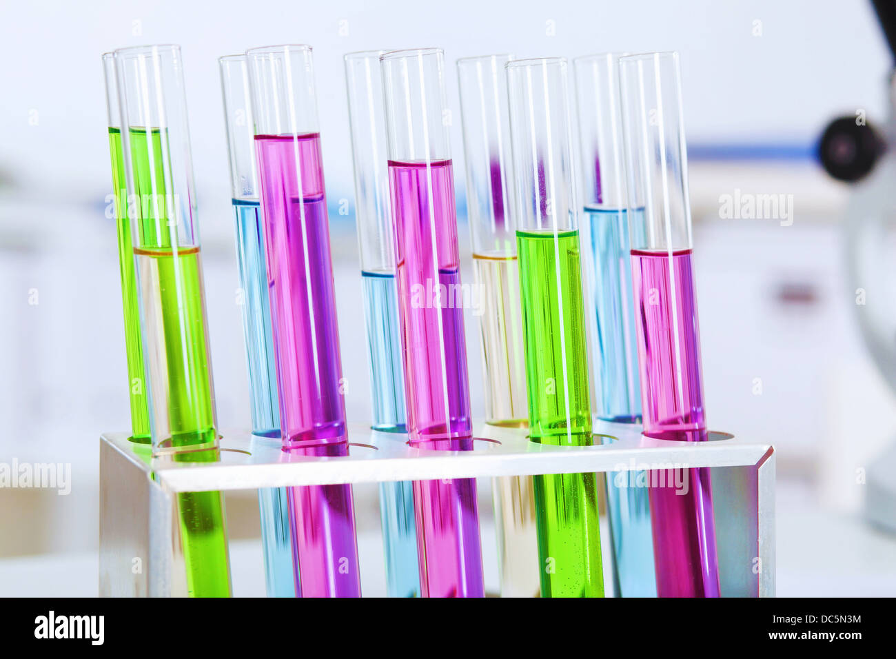 Chemistry laboratory glassware with colour liquids Stock Photo - Alamy