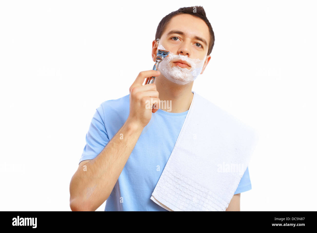 Young man shaving himself close hi-res stock photography and images - Alamy