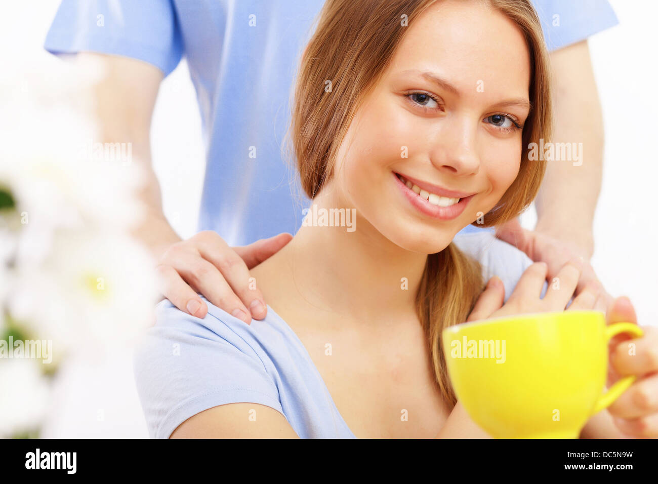 Beautiful young woman drinking tea Stock Photo - Alamy