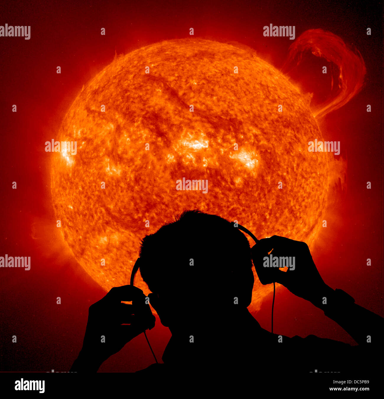man with headphones listening to sounds of a sun image Stock Photo - Alamy