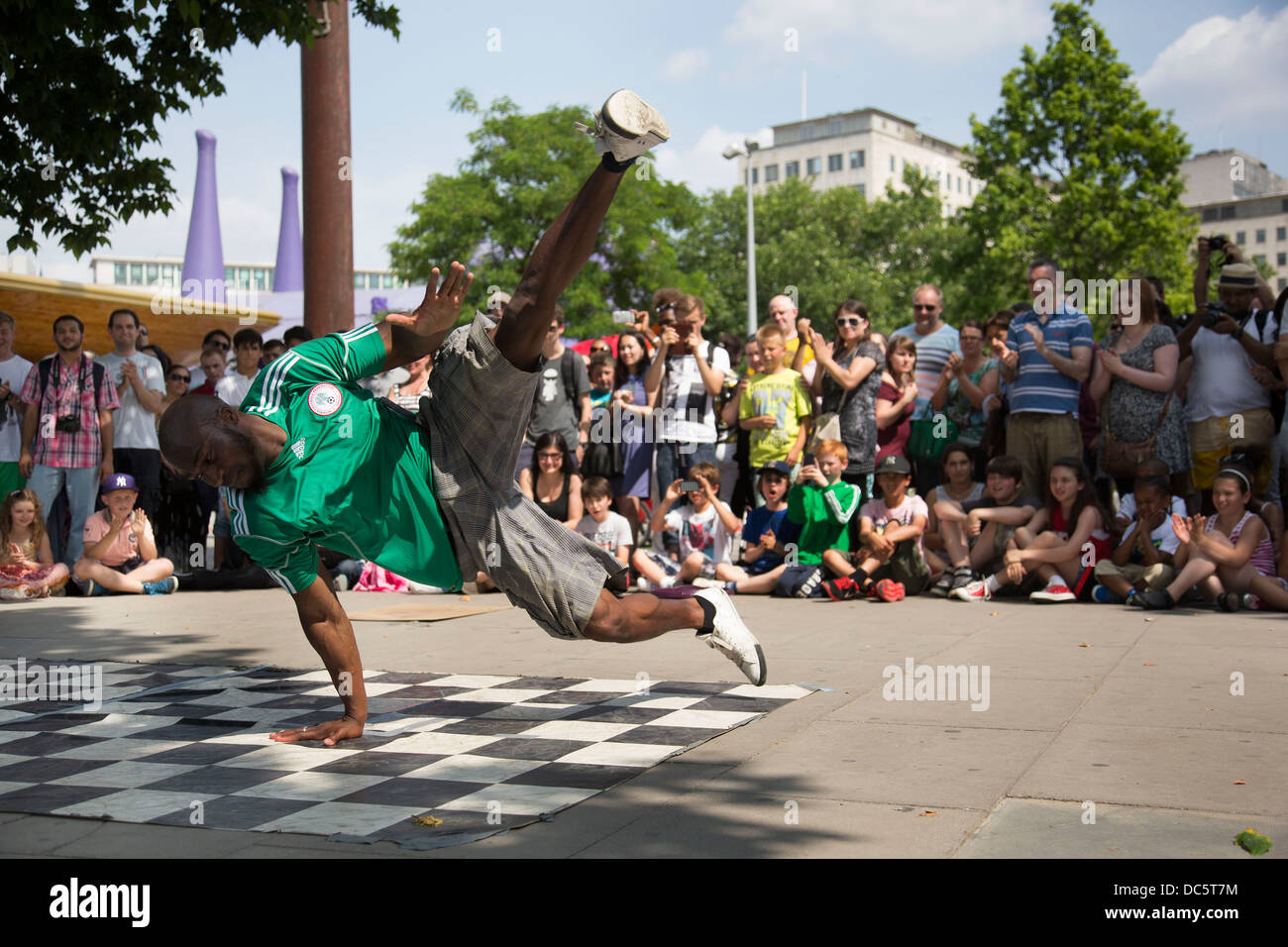Break dance group One Motion Crew perform for money to a busy crowd of ...