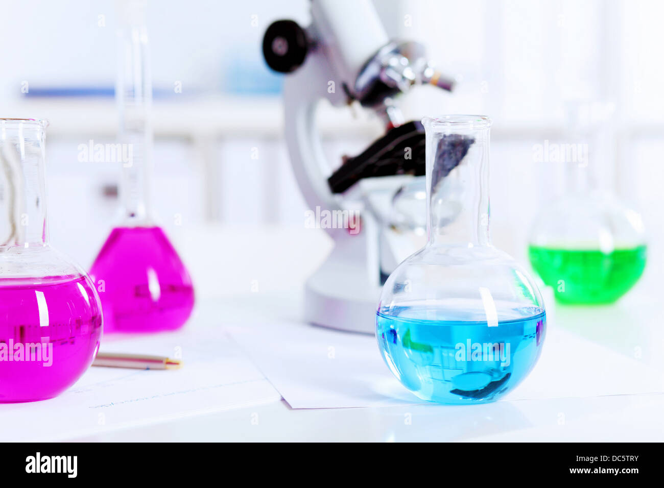 Chemistry laboratory glassware with colour liquids Stock Photo - Alamy