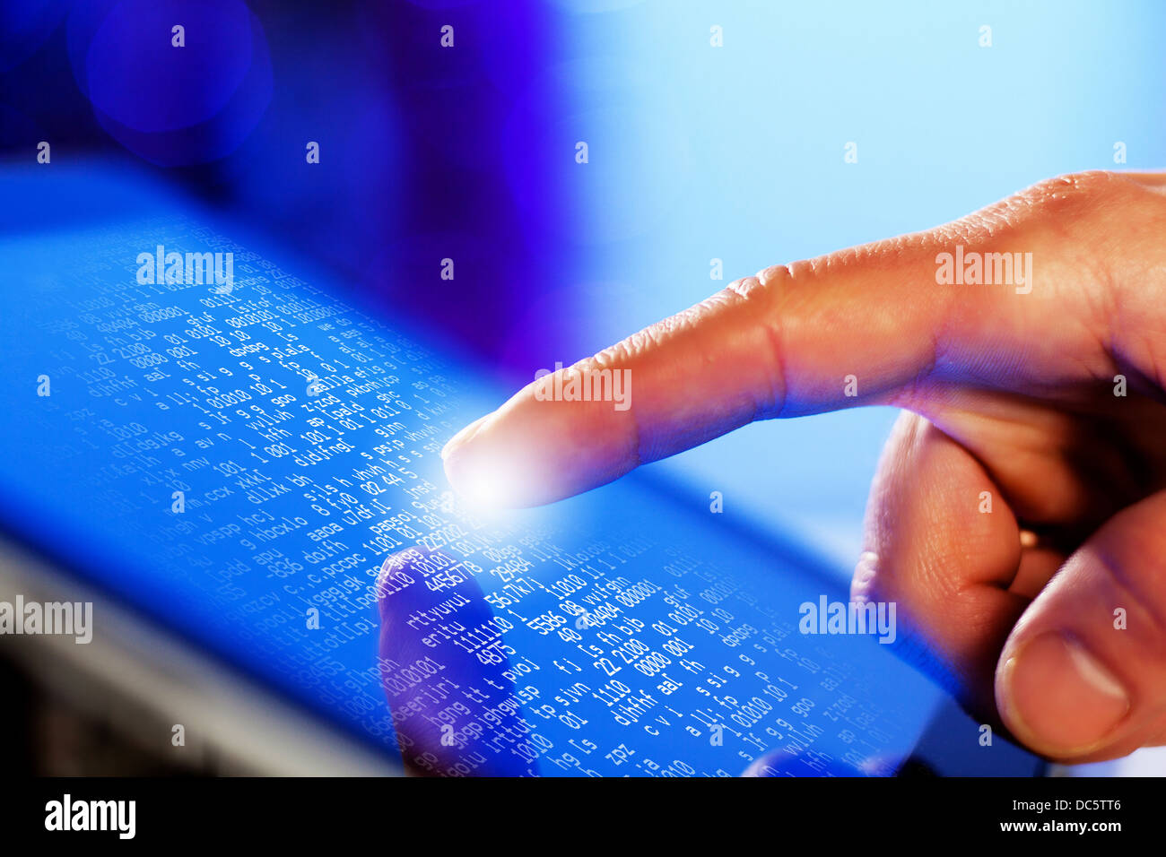 Closeup of finger touching tablet-pc screen Stock Photo - Alamy