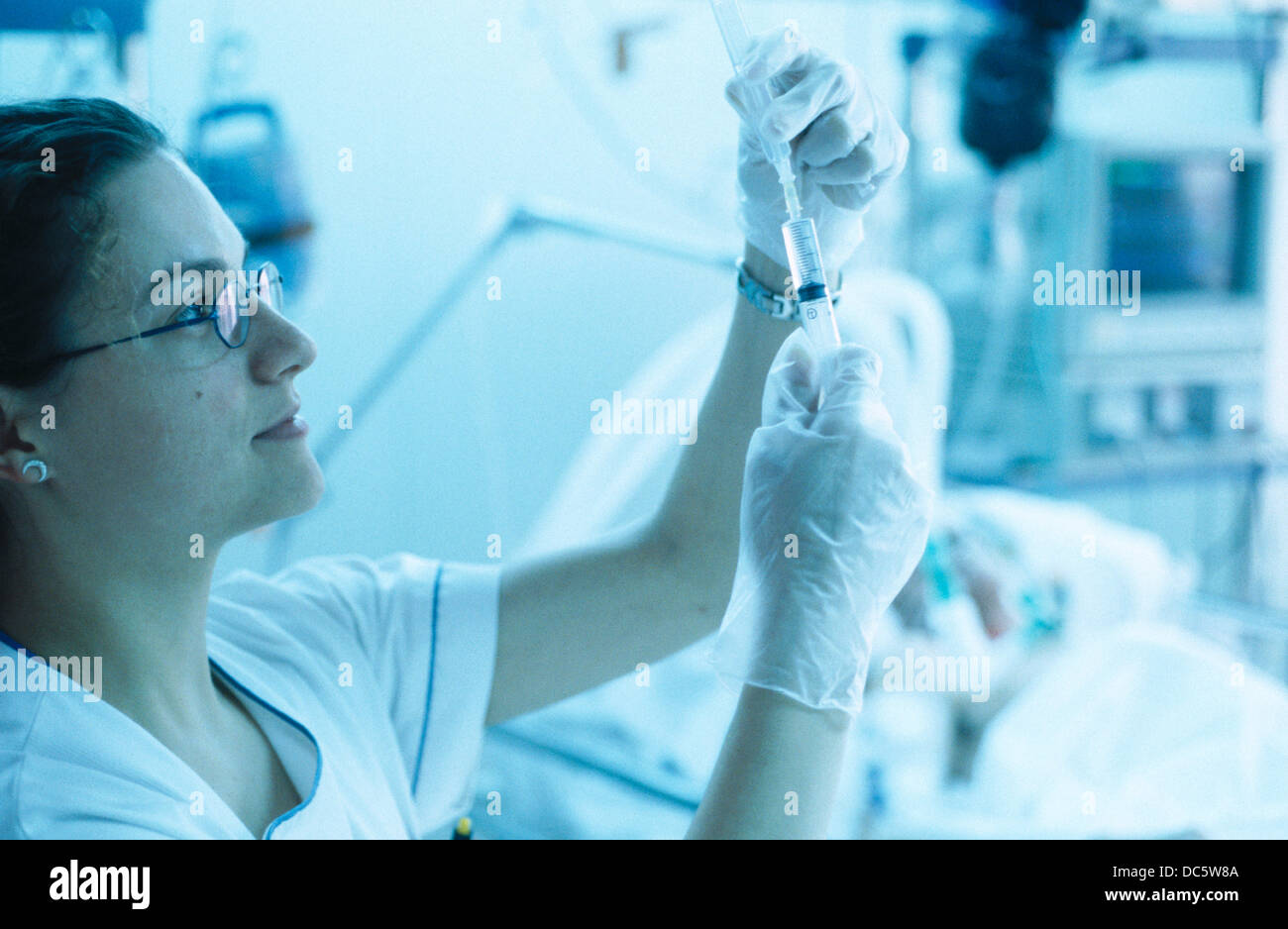 Nurse with syringe at ICU, Intensive Care Unit Stock Photo - Alamy