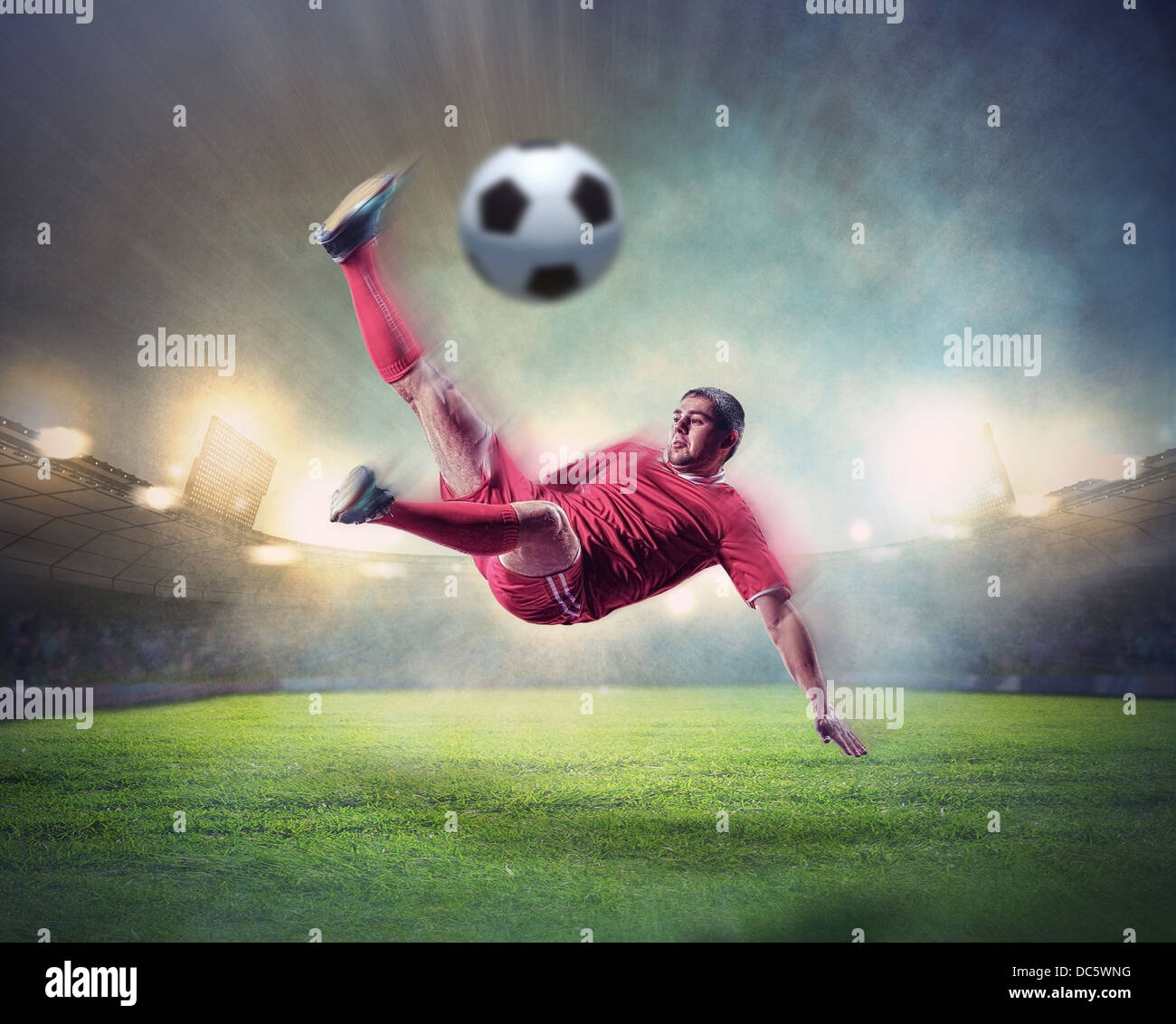 football player striking the ball Stock Photo - Alamy