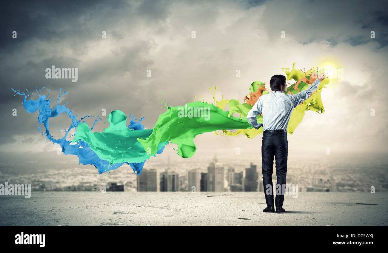 Man painting splashes Stock Photo - Alamy