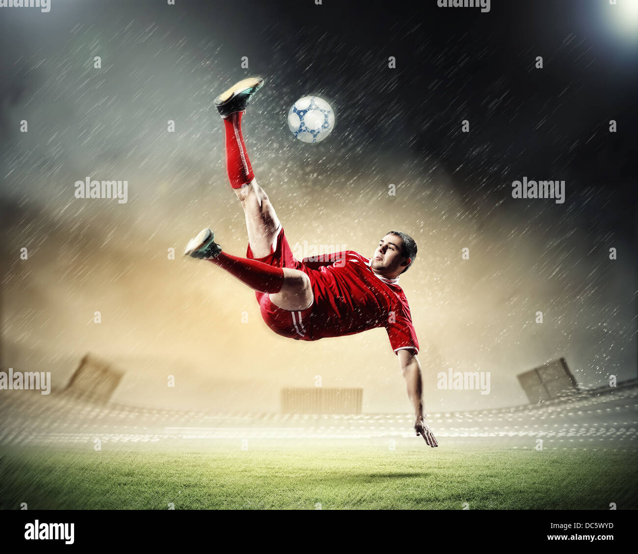 football player striking the ball Stock Photo - Alamy