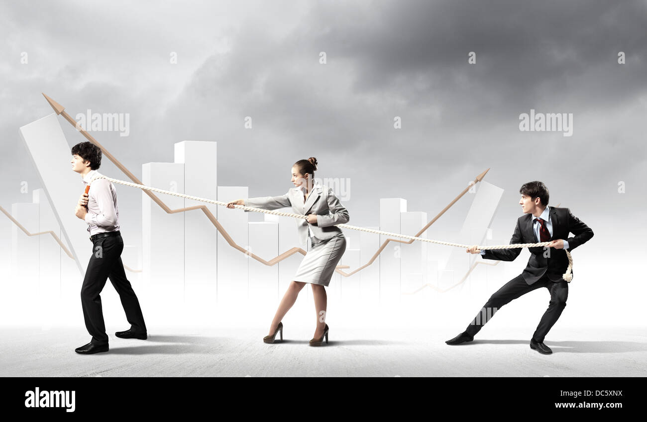 Three business people pulling rope Stock Photo - Alamy