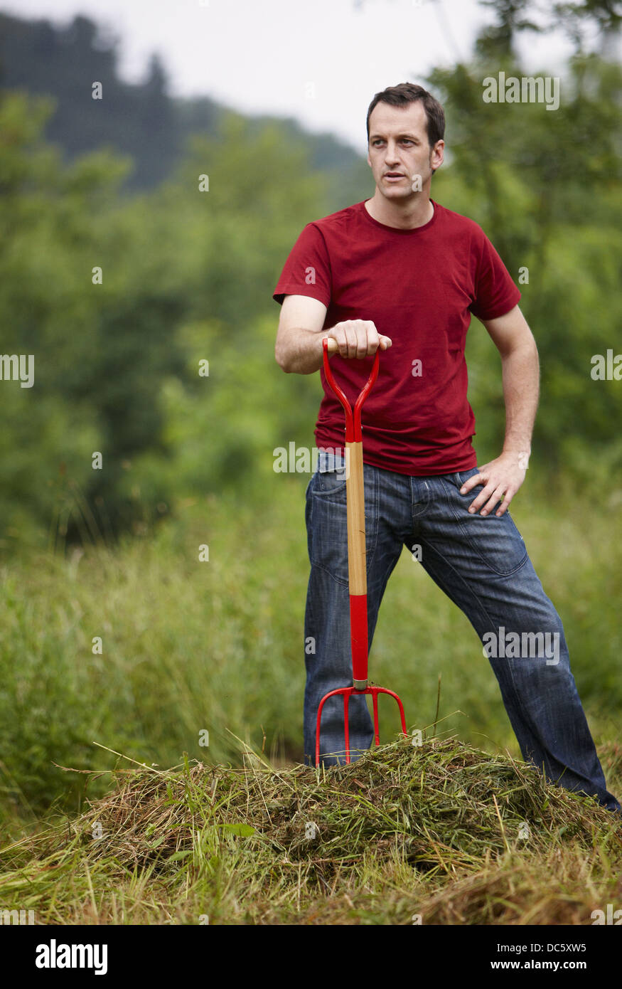 Man holding pitchfork hi-res stock photography and images - Alamy