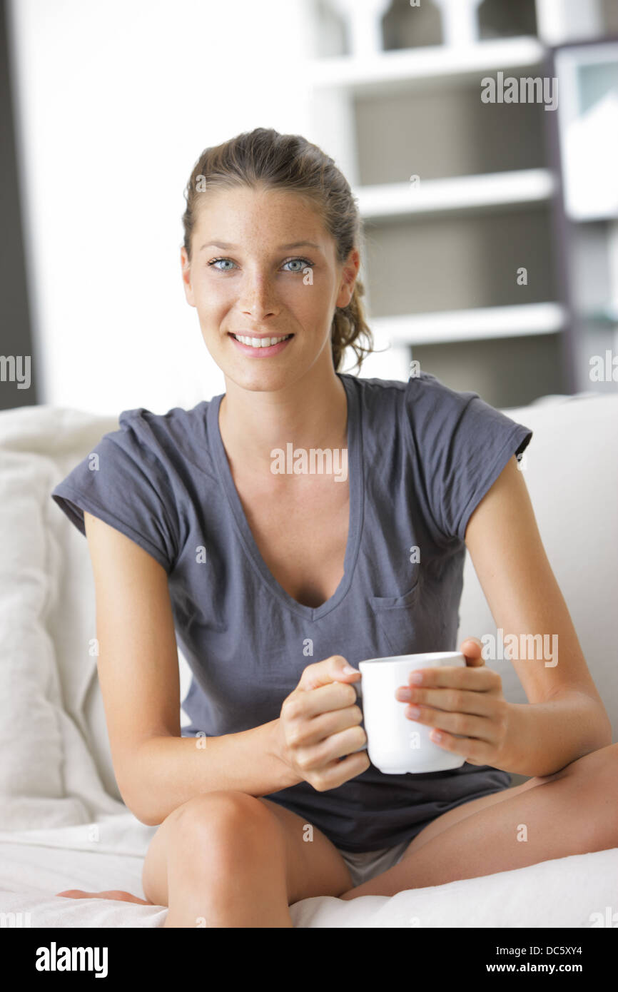Cute young lady with a cup of coffee Stock Photo - Alamy