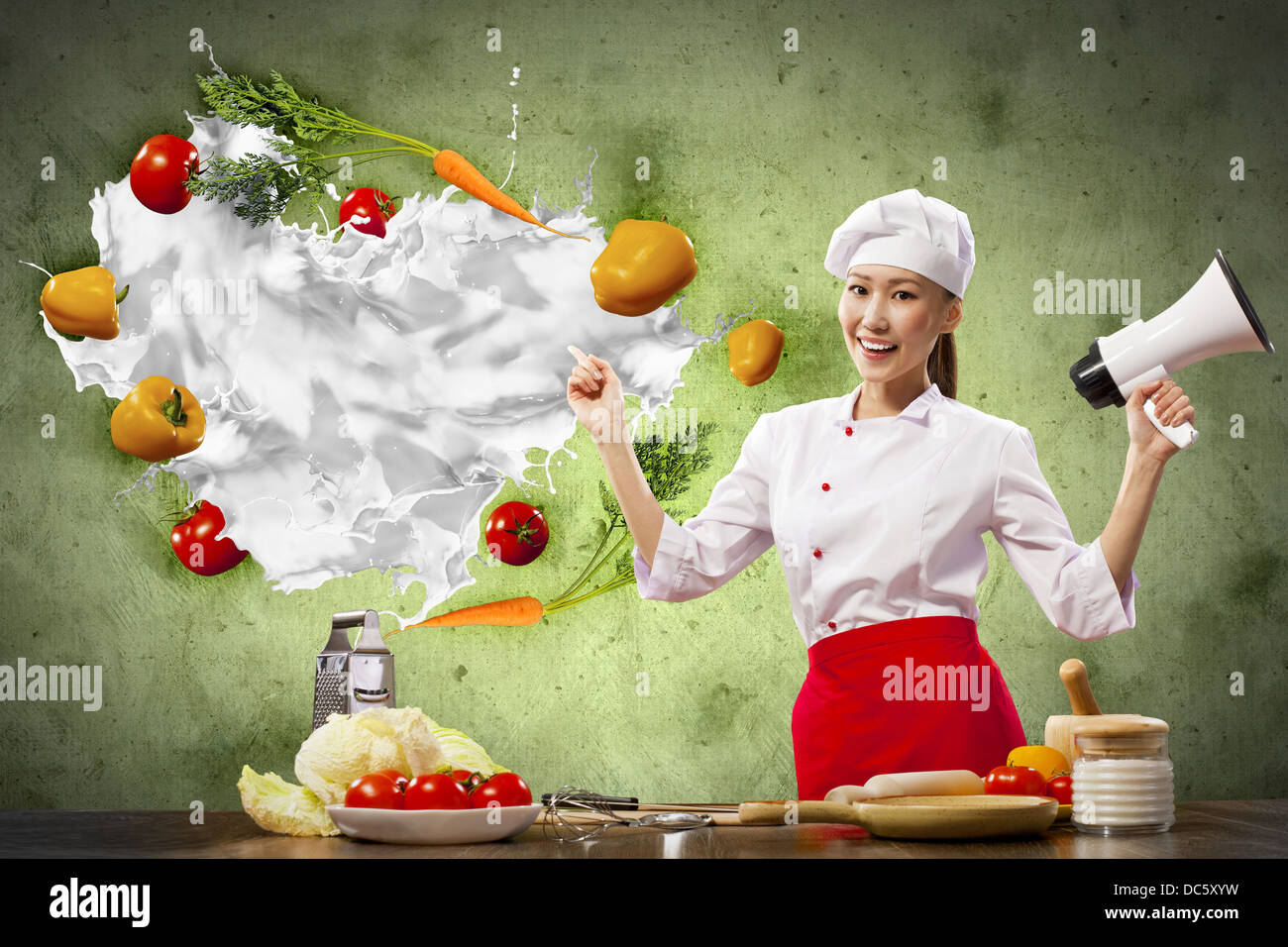 Asian female cook holding megaphone Stock Photo - Alamy