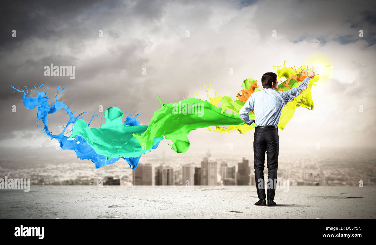 Man painting splashes Stock Photo - Alamy